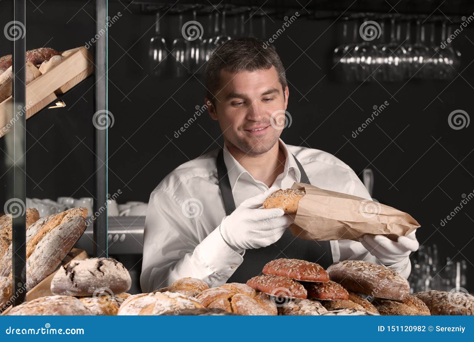 Handsome Man with Freshly Baked Bread Working in Bakery Shop Stock ...