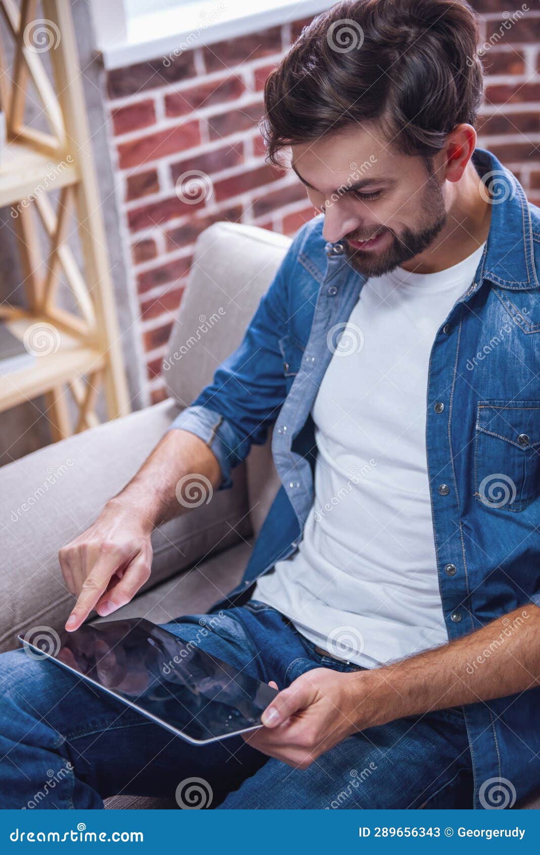 Handsome man with gadget stock image. Image of leisure - 289656343