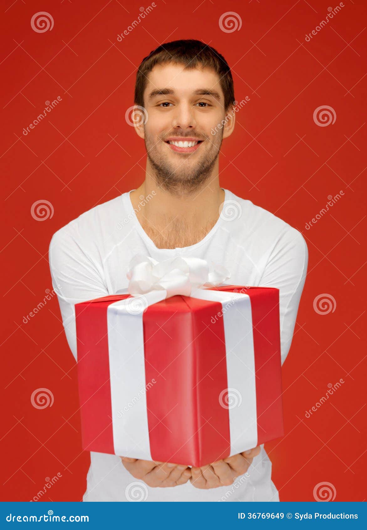Handsome man with a gift stock image. Image of season - 36769649