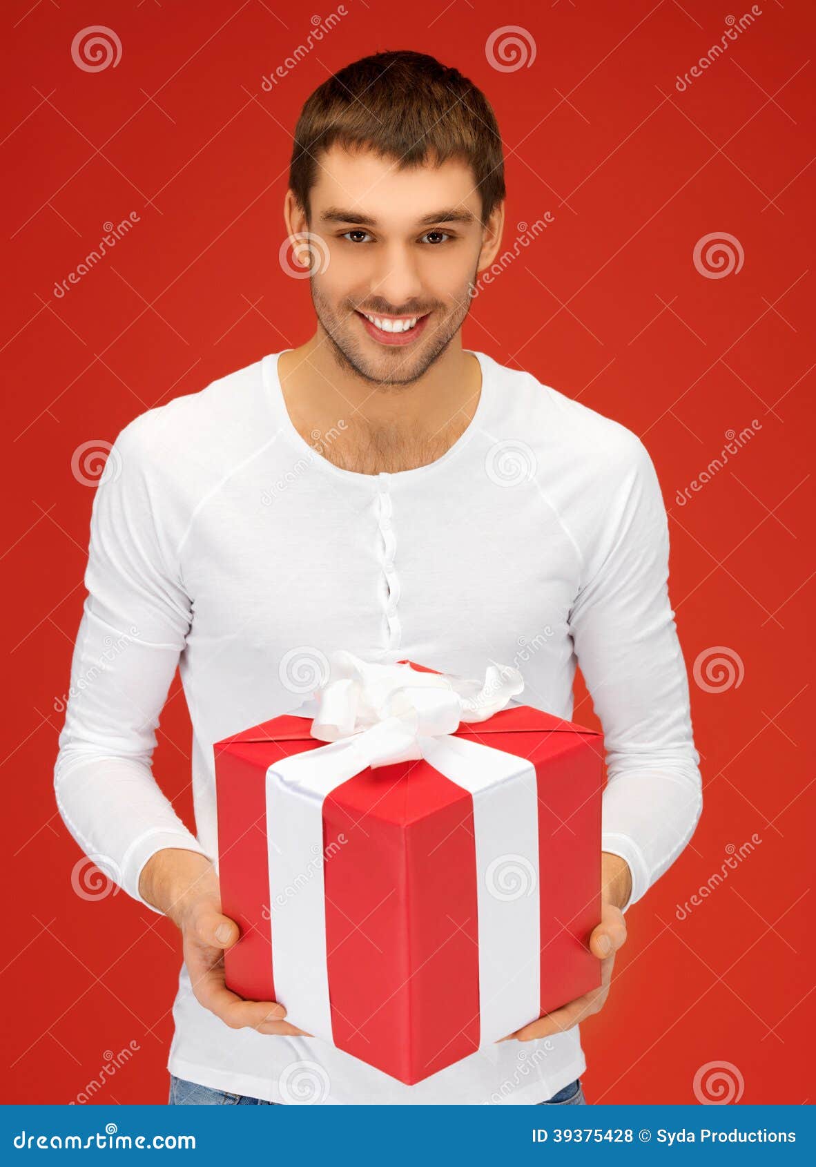 Handsome man with a gift stock photo. Image of merry - 39375428