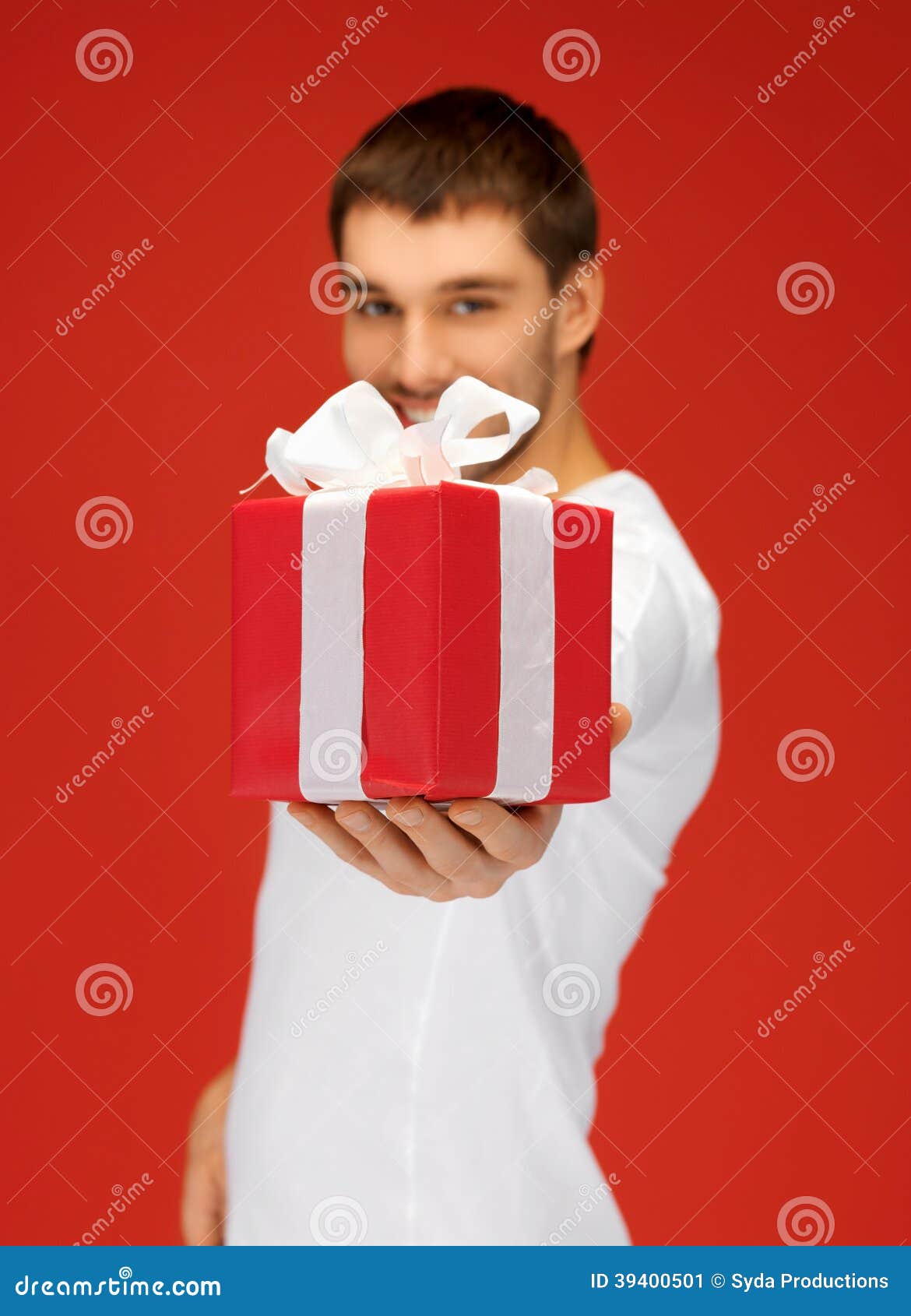 Handsome man with a gift stock image. Image of ribbon - 39400501