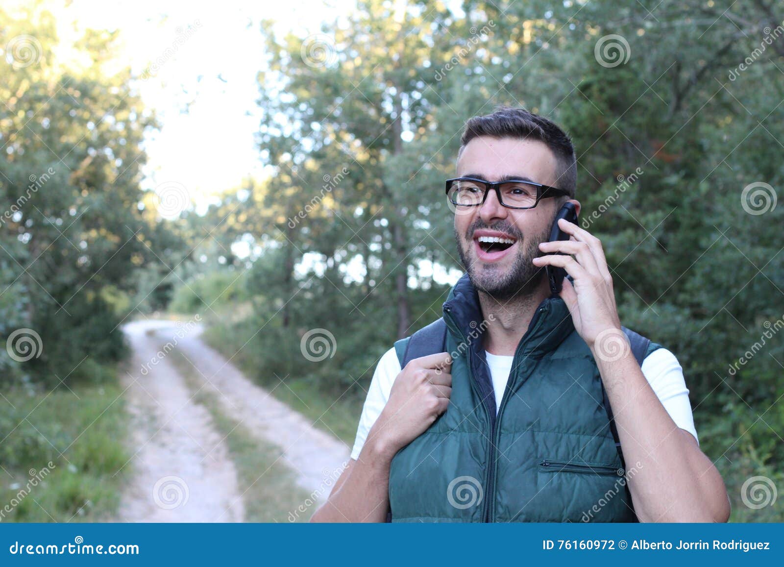Handsome Man with Glasses Phoning in the Park. Beautiful Man with Hand ...