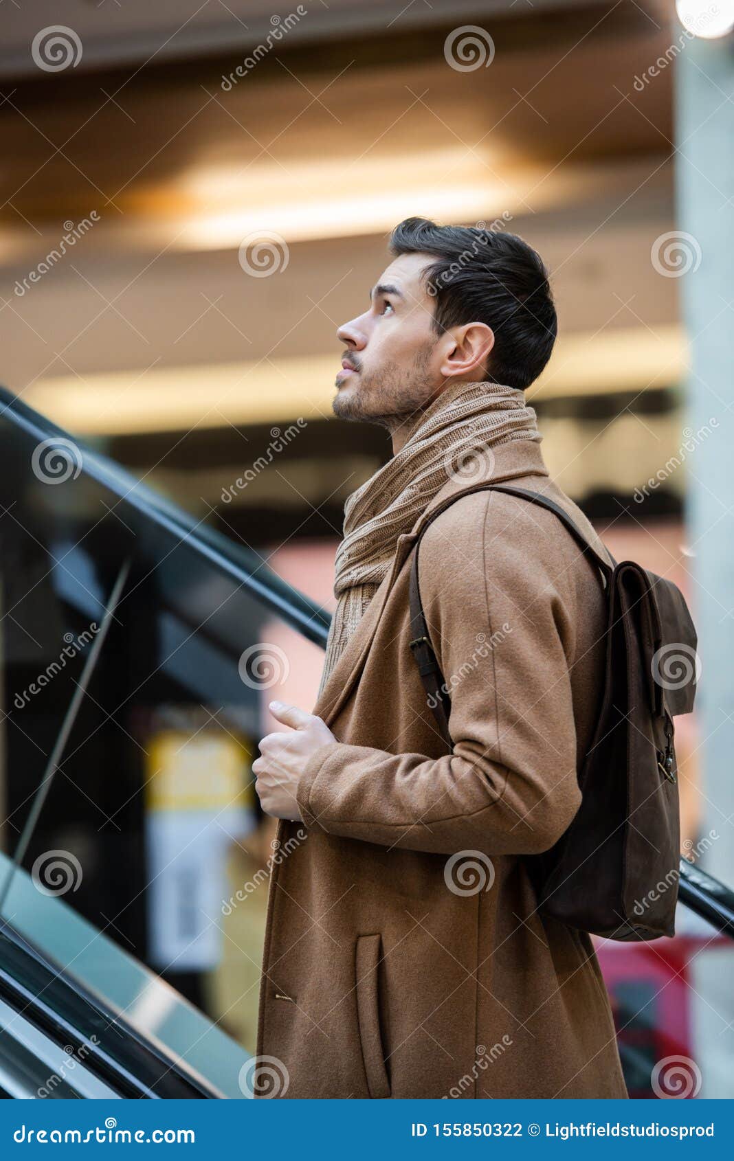 Handsome Man Going Up on Escalator in Stock Photo - Image of indoors ...