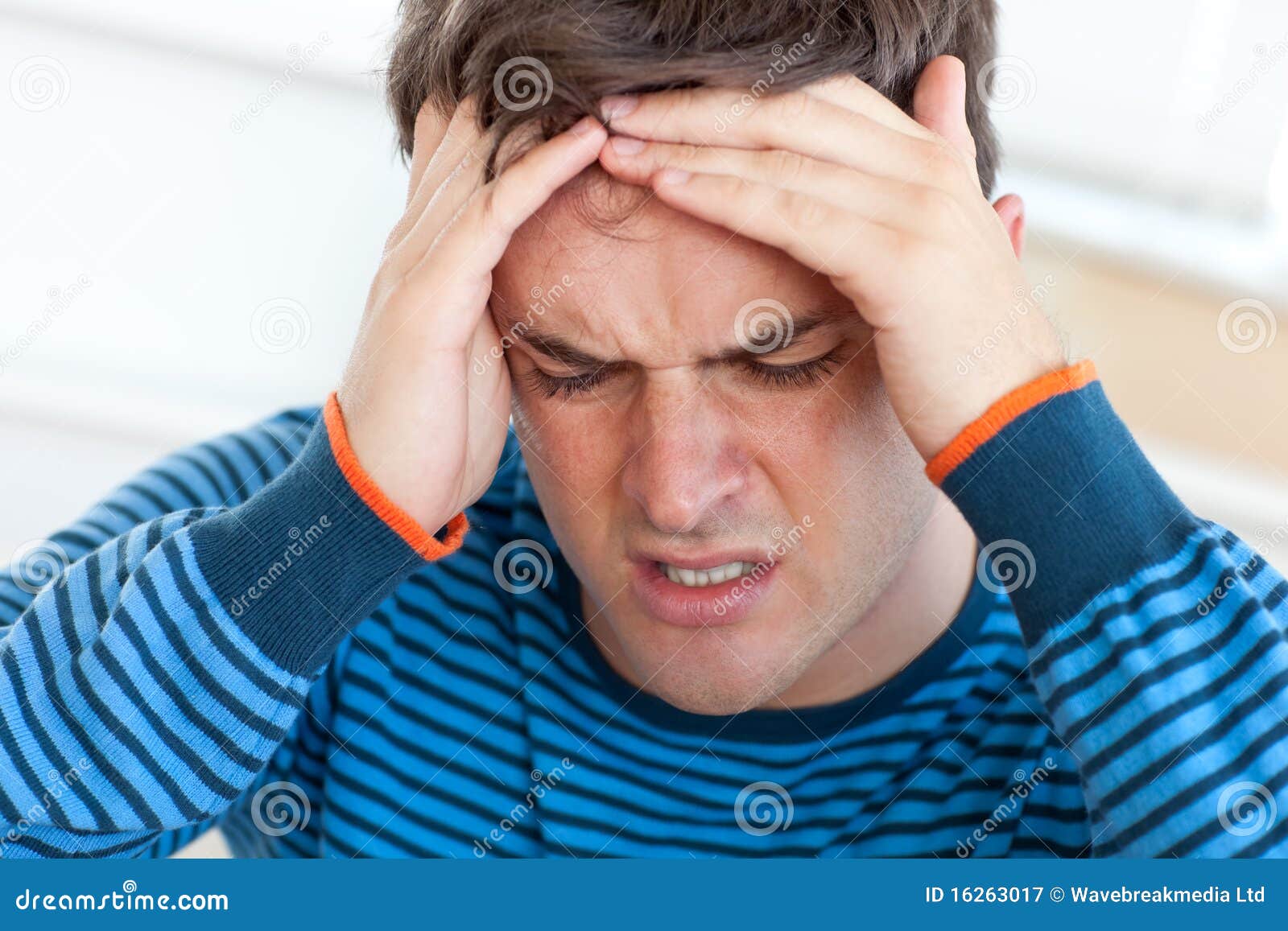 Handsome Man Having a Headache in the Living-room Stock Image - Image ...