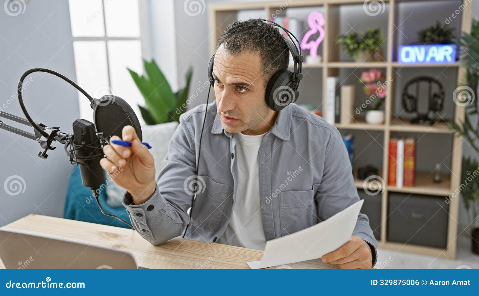Handsome Man with Headphones in Radio Studio Holding Script on-air ...