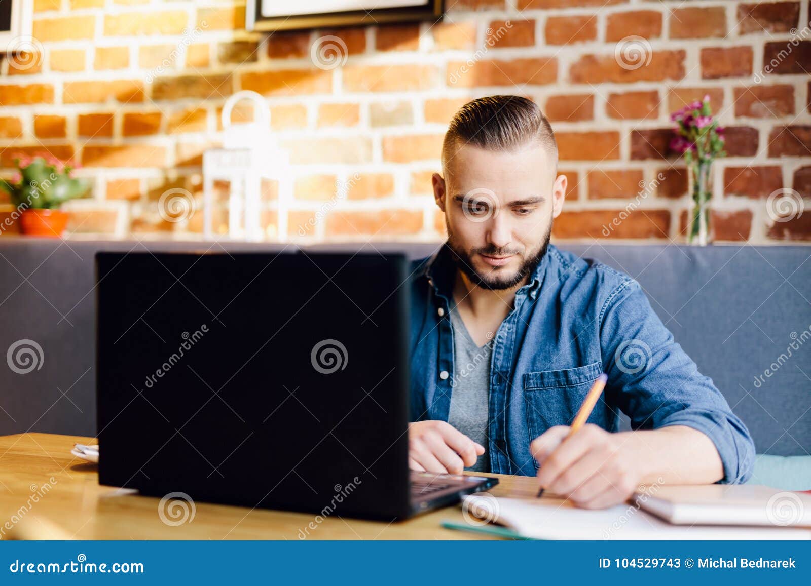 Man in a Cafe with Laptop and Documents. Stock Image - Image of create ...