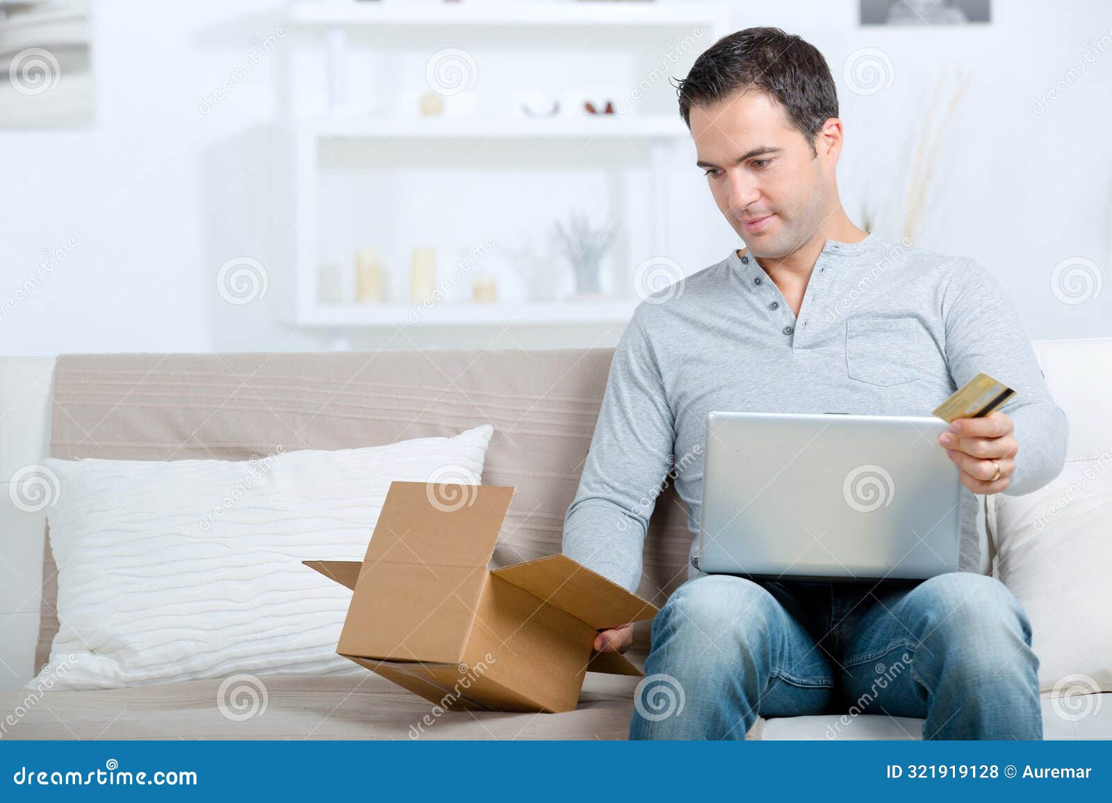 Handsome Man Holding Credit Card while Opening Box Stock Photo - Image ...