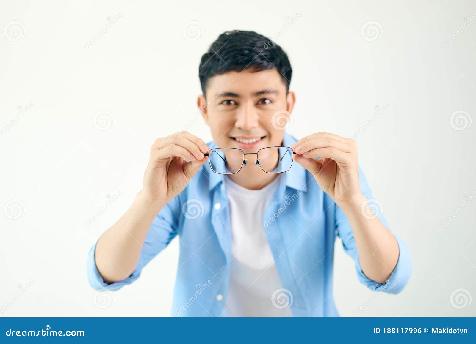Handsome Man Holding Glasses before His Eyes Stock Photo - Image of ...