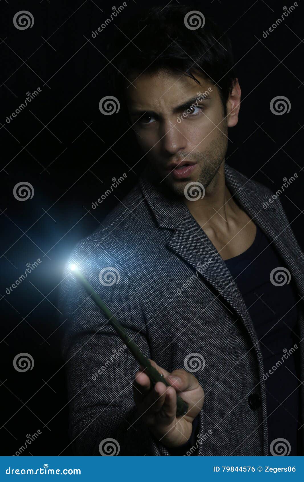 Handsome Man Holding a Magic Wand Stock Photo - Image of magical, wand ...