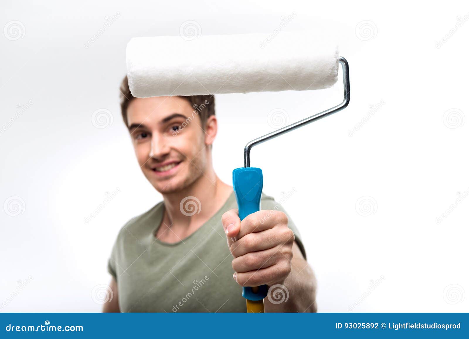 Handsome Man Holding Paint Roller and Looking at Camera Isolated on ...
