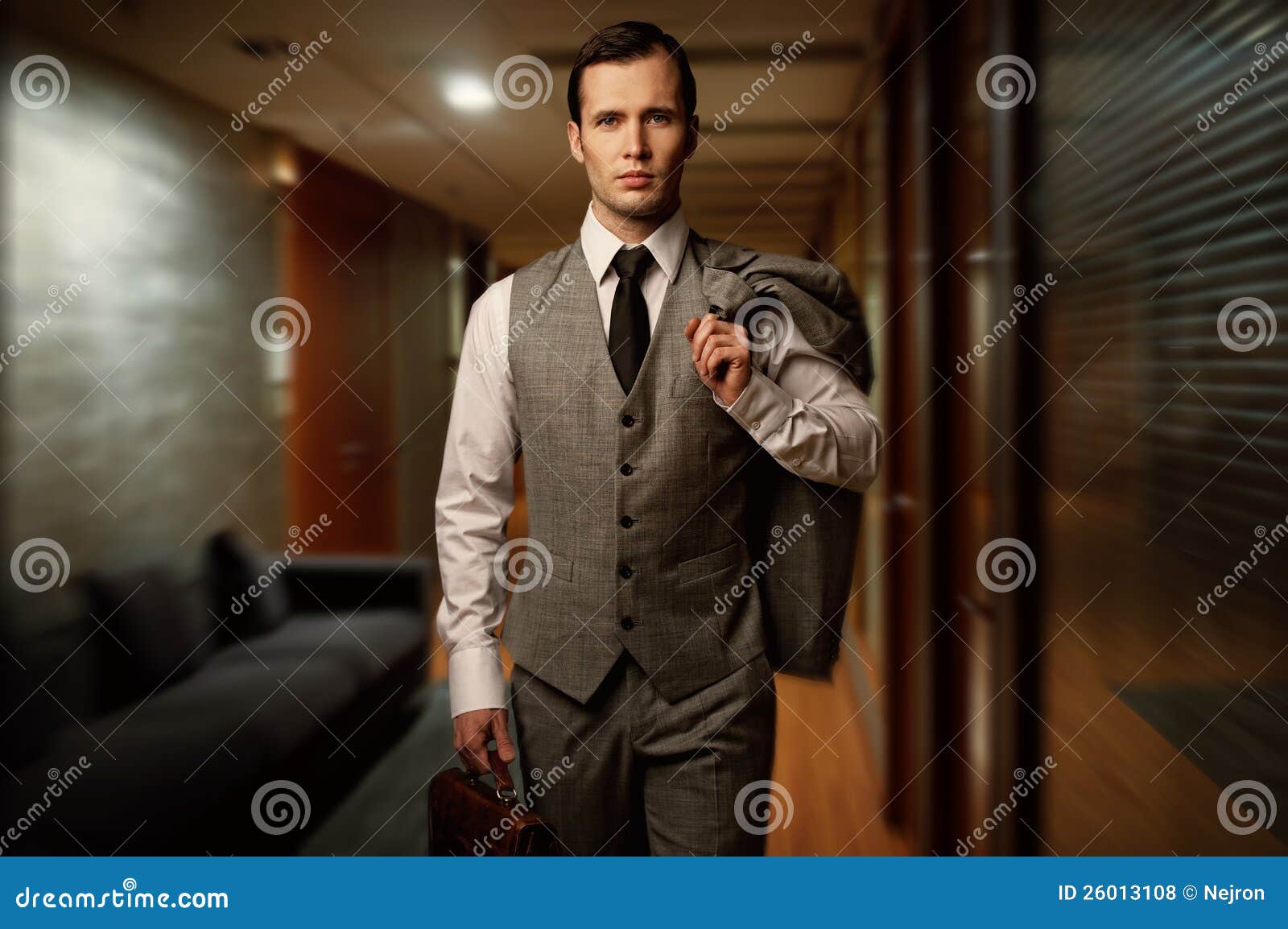 Handsome man in a hotel stock photo. Image of classic - 26013108