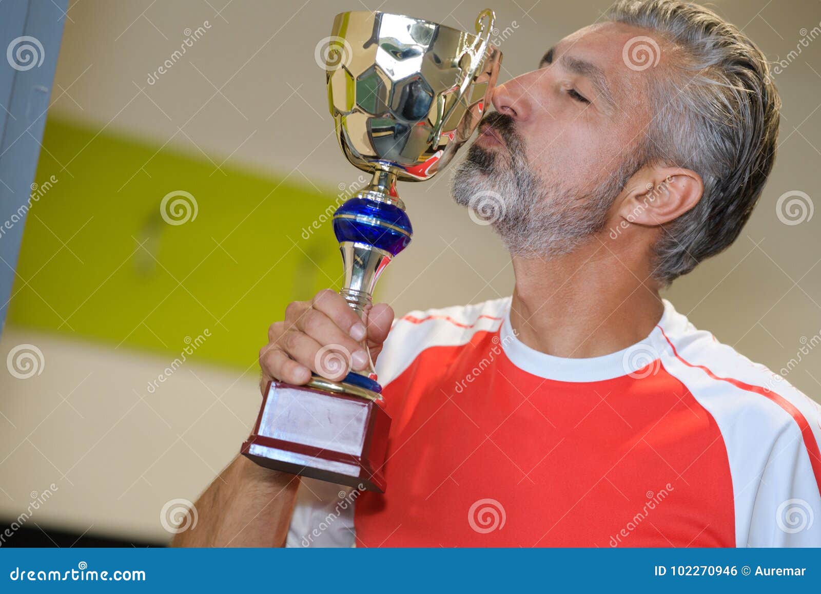 Handsome Man Kissing Trophy Stock Photo - Image of slim, achievement ...
