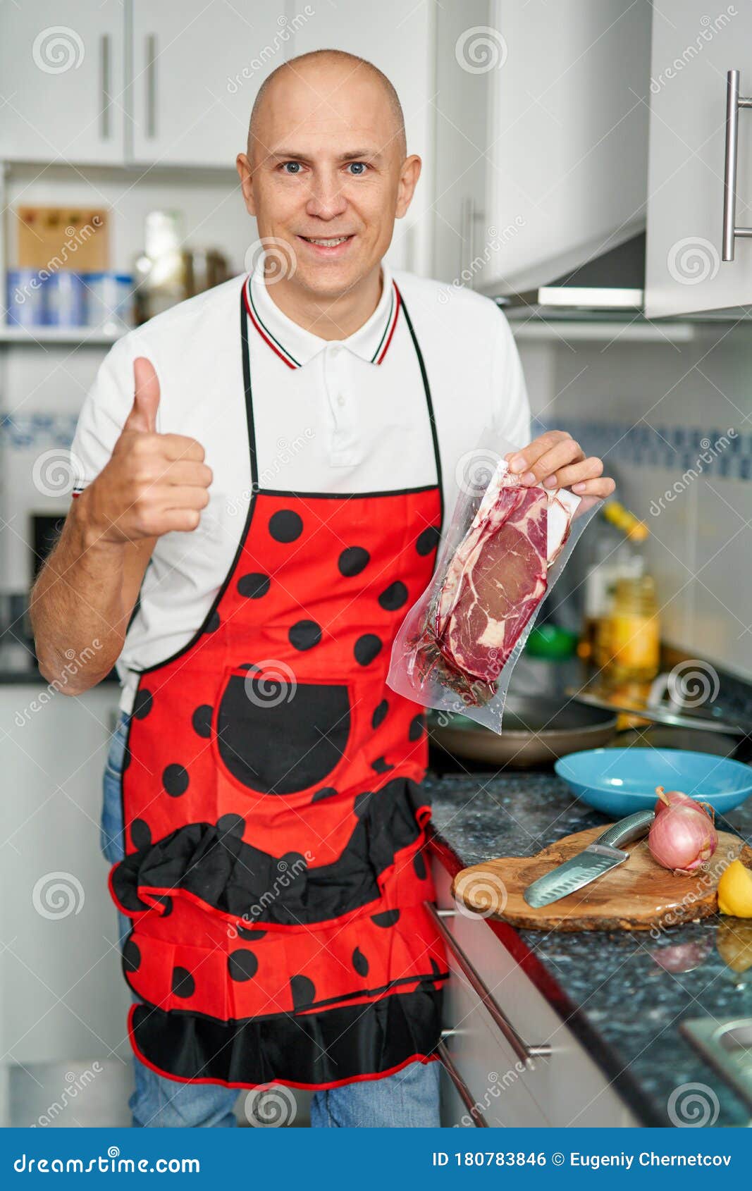 Handsome Man at the Kitchen. Male with Meat. Stock Photo - Image of ...