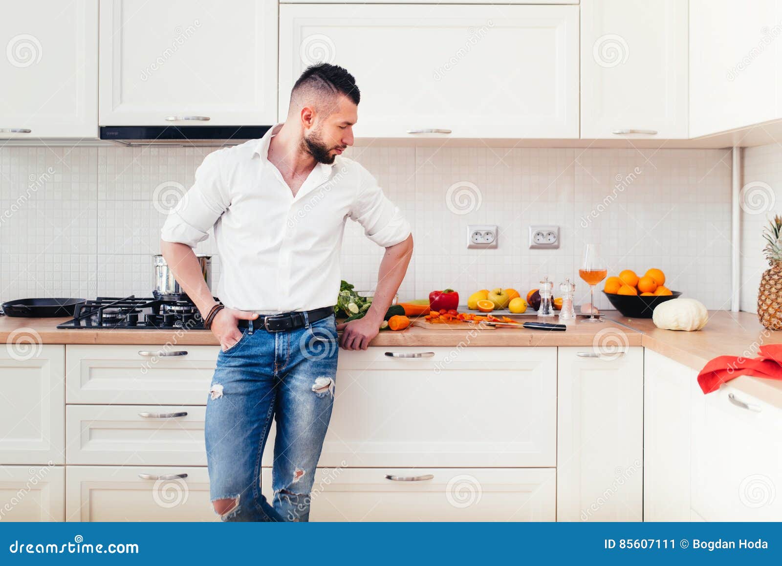 Handsome Man in Kitchen Preparing Food, Cooking and Posing Stock Image ...