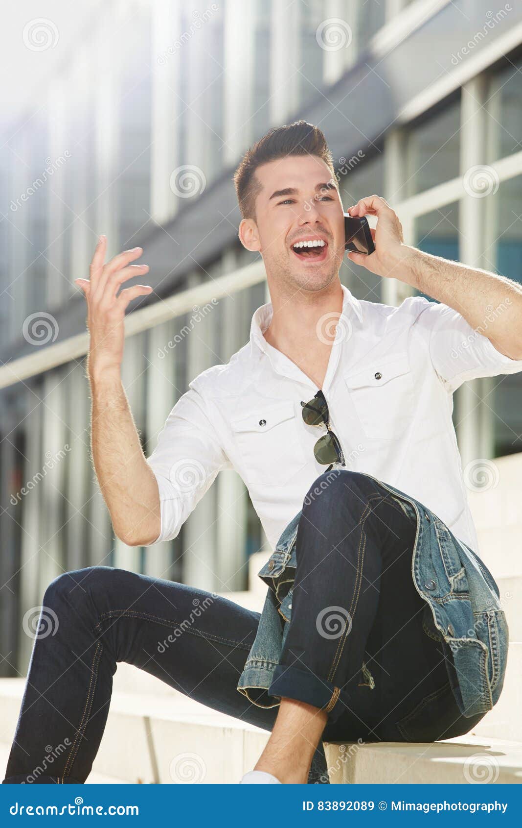 Handsome Man Laughing with Cellphone Stock Image - Image of cell, adult ...