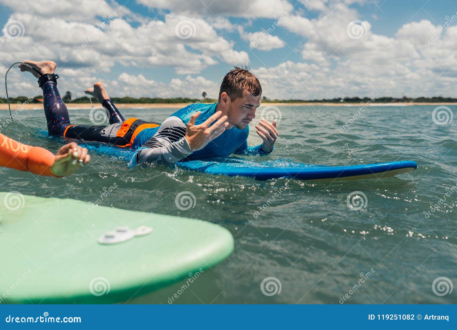 Man is Laying on Surfboard in the Ocean Stock Photo - Image of person ...