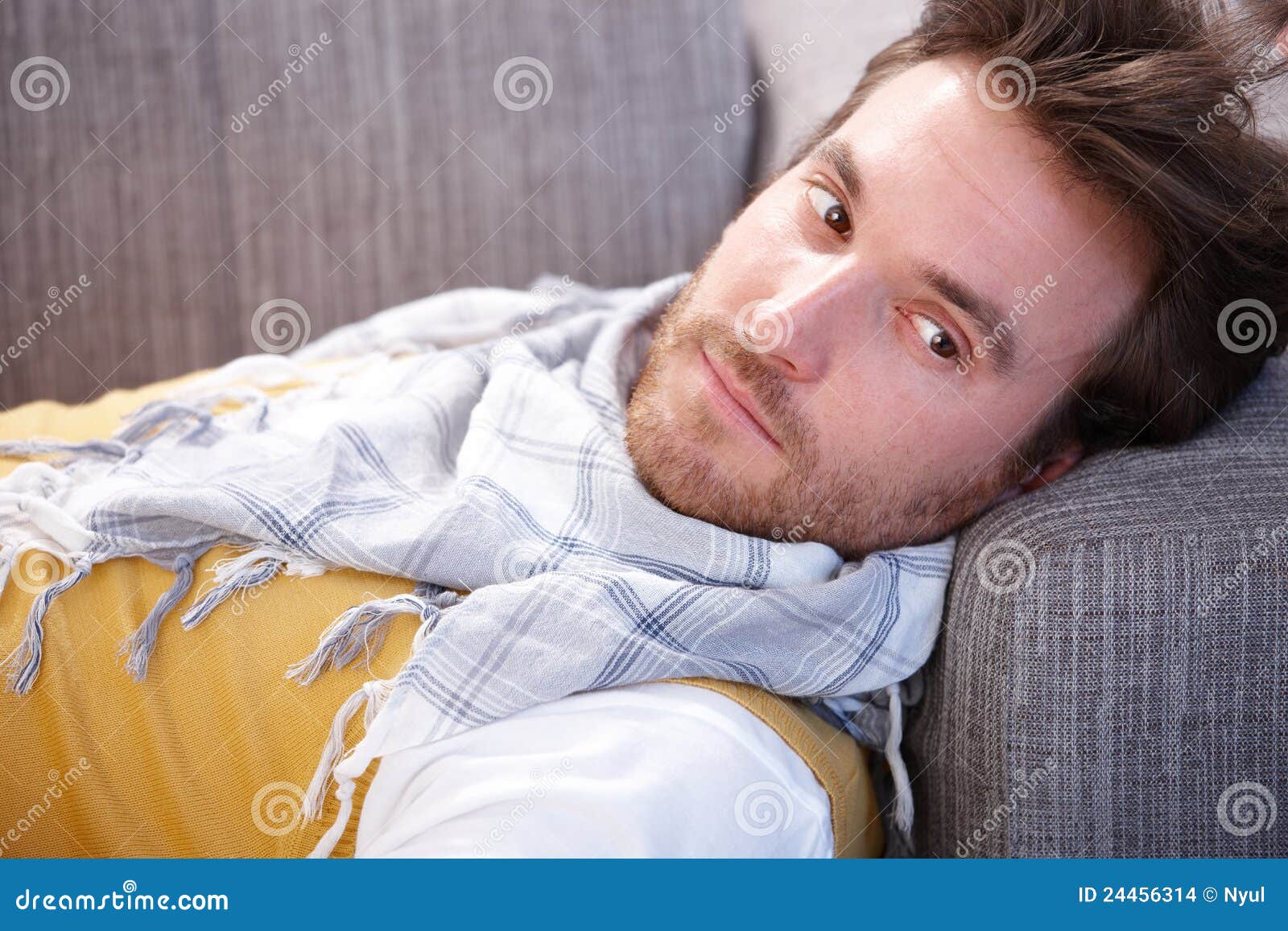 Handsome Man Laying on Sofa Daydreaming Stock Photo - Image of home ...