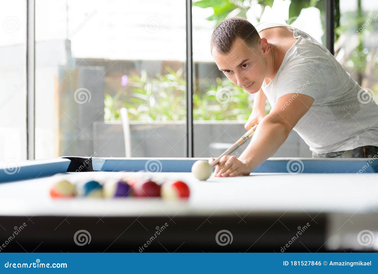 Handsome Man Leaning on Pool Table while Playing Billiard Stock Photo ...