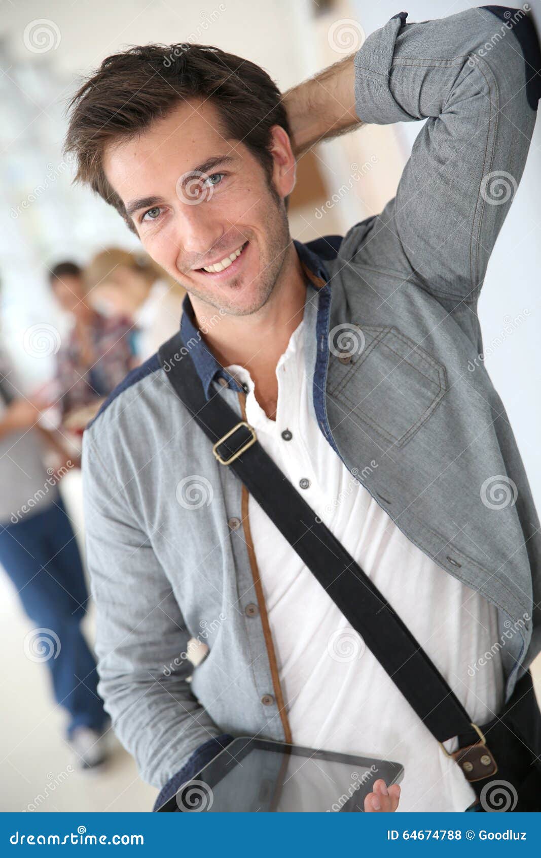 Handsome Man Leaning on the Wall with Tablet Stock Photo - Image of ...