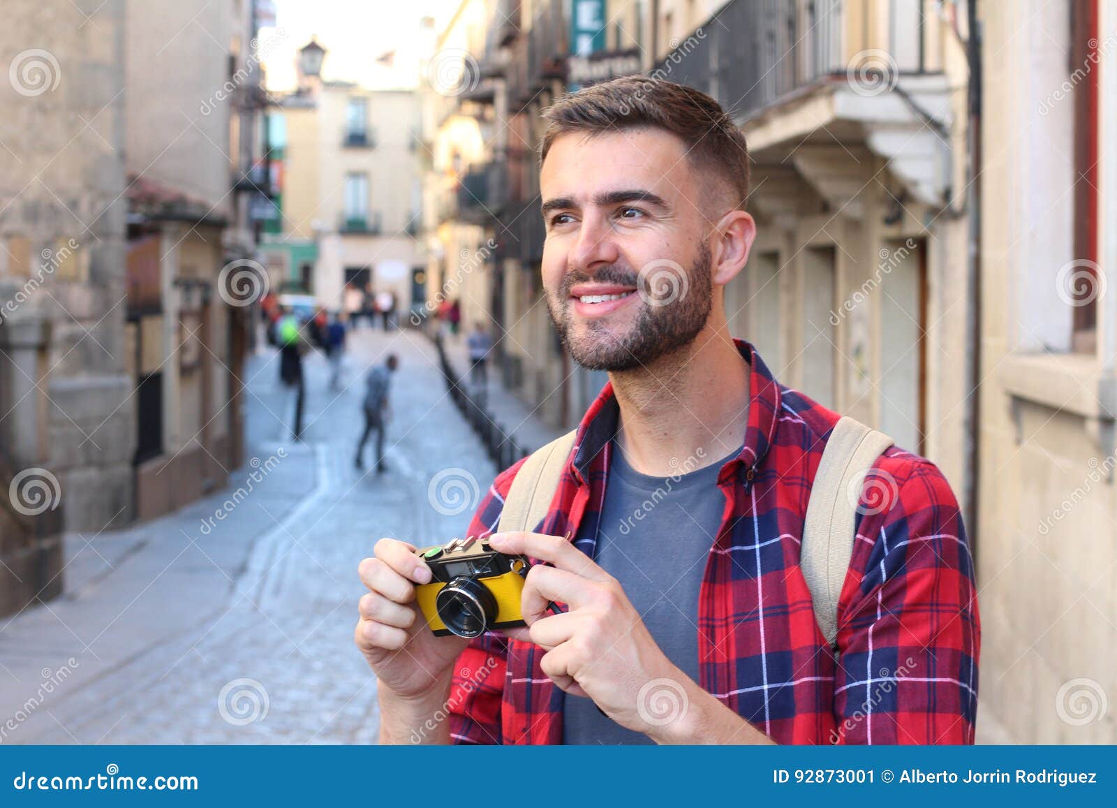 Handsome Man Looking Away Holding a Vintage Camera during Trip Stock ...