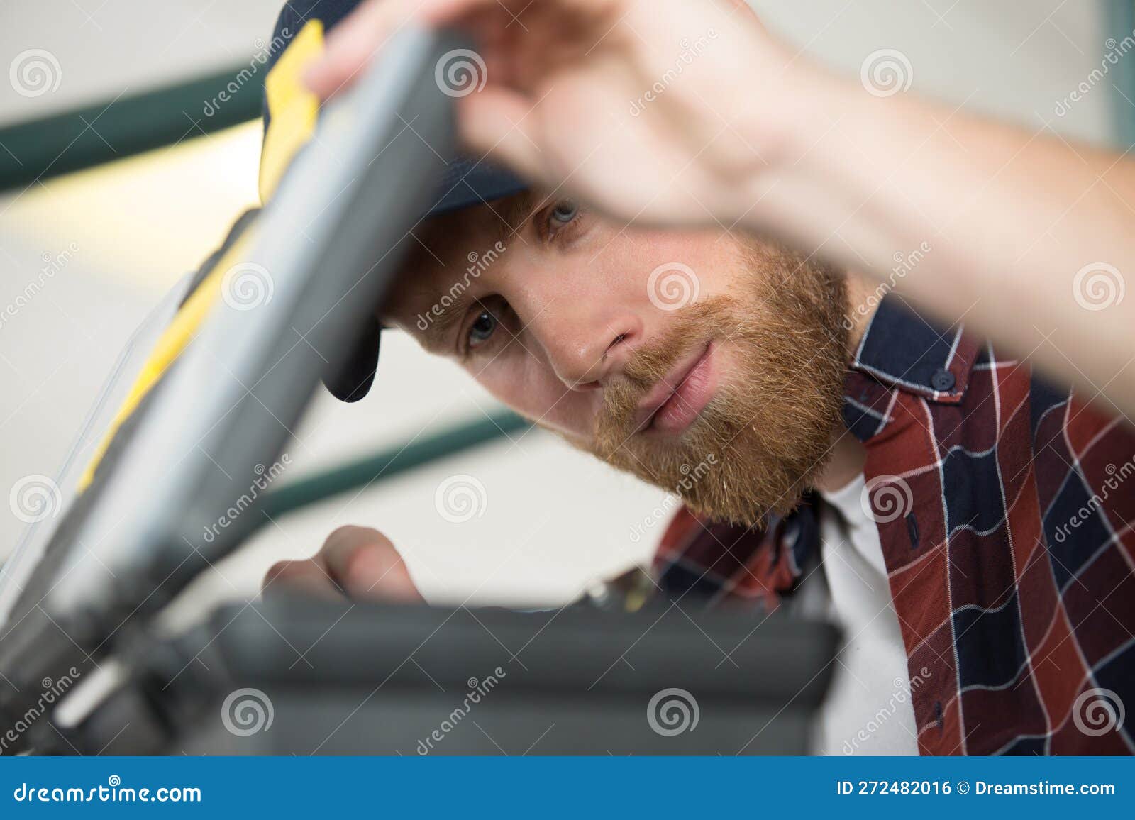 Handsome Man Looking Inside Tool Box while Standing in Kitchen Stock ...