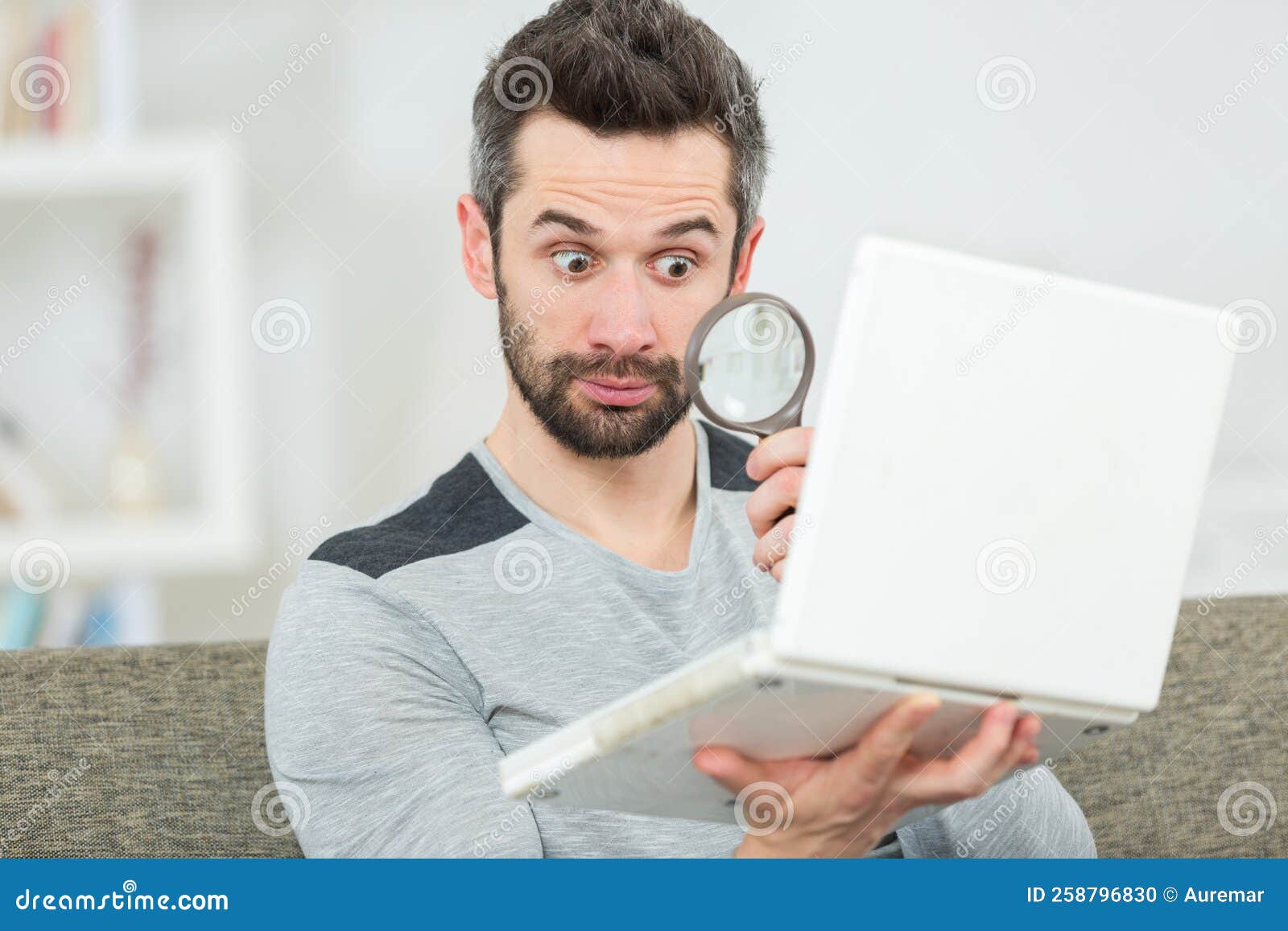 Handsome Man Looking at Laptop through Manifying Glass Stock Photo ...