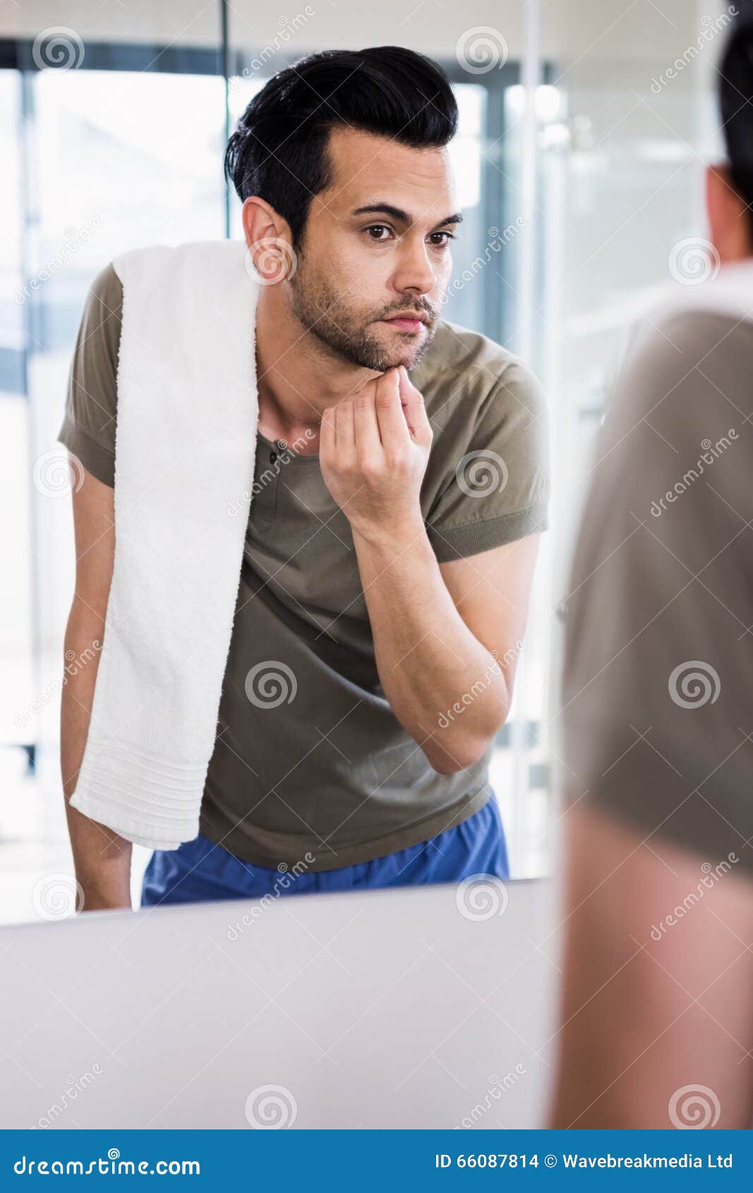 Handsome Man Looking in Mirror Stock Photo - Image of homey, handsome ...