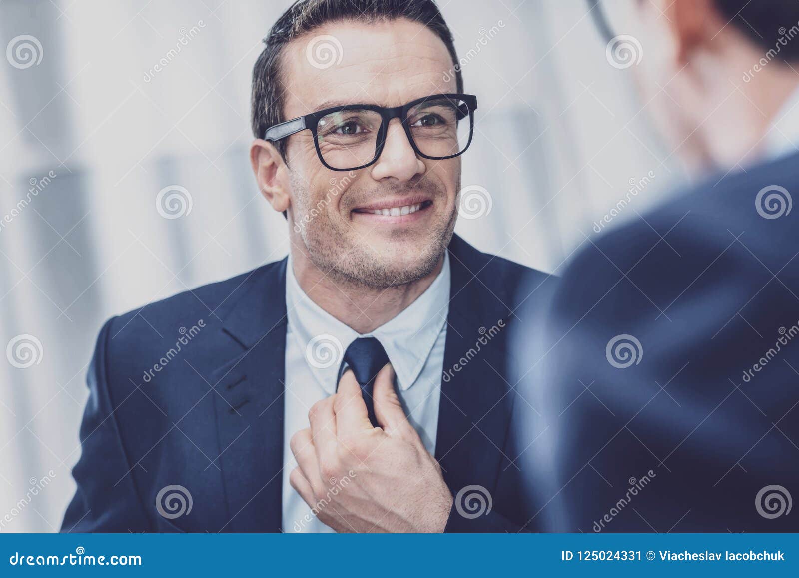 Handsome Man Looking at Mirror Stock Image - Image of office ...