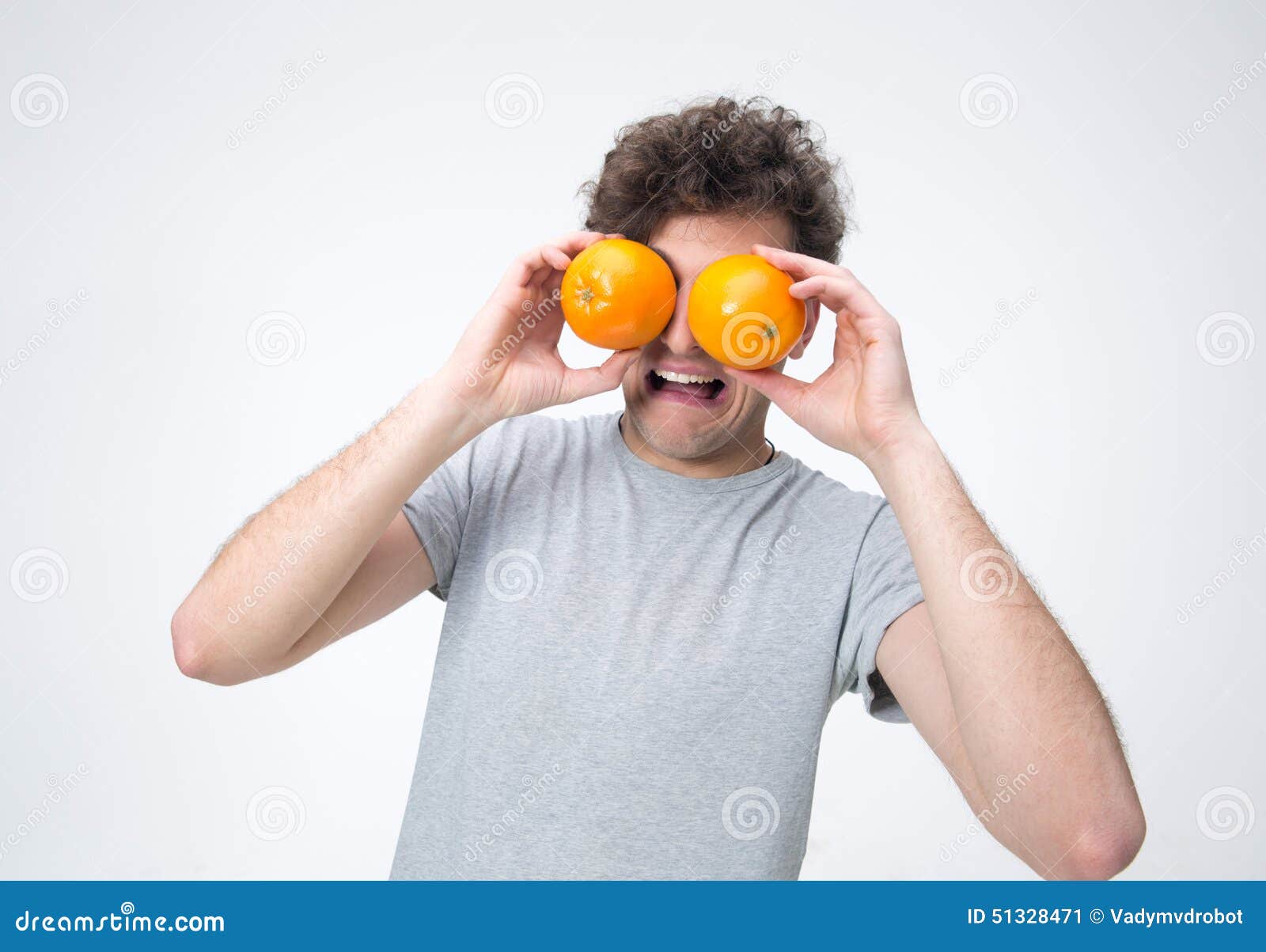 Handsome Man Looking through Oranges Stock Image - Image of fruit, eyes ...