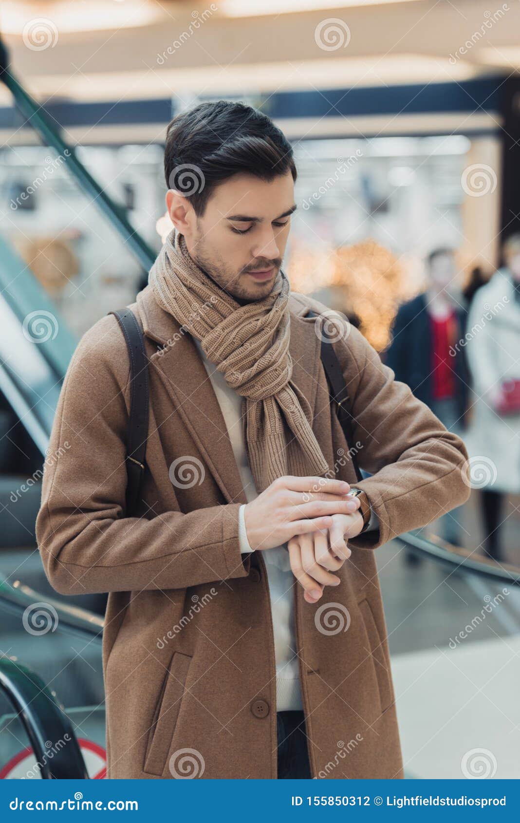 Handsome Man Looking at Watch in Stock Photo - Image of looking, male ...