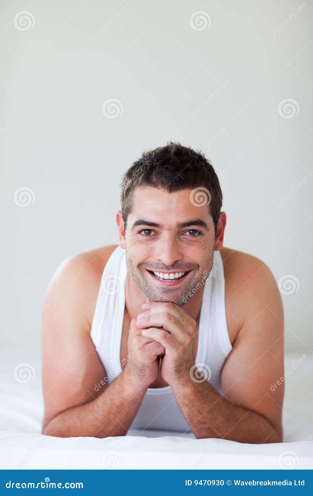 Handsome Man Lying in Bed Smiling Stock Photo - Image of caucasian ...