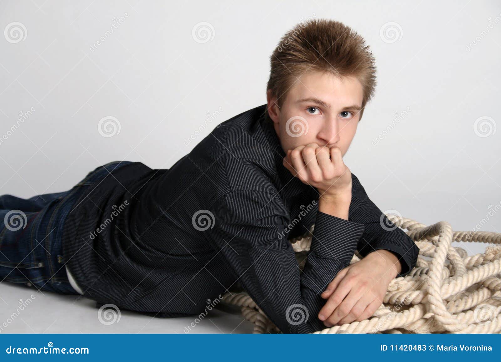 Handsome man lying on rope stock image. Image of funny - 11420483