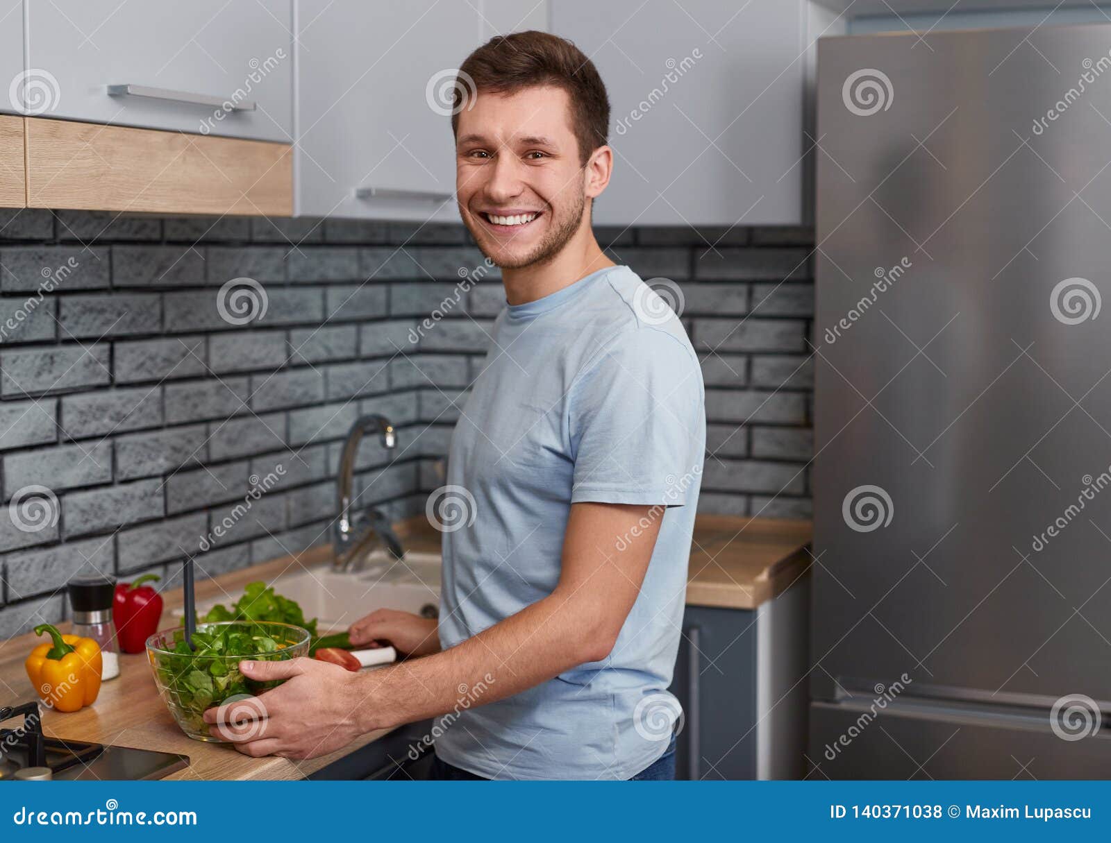 Handsome Man Making Salad in Kitchen Stock Photo - Image of organic ...
