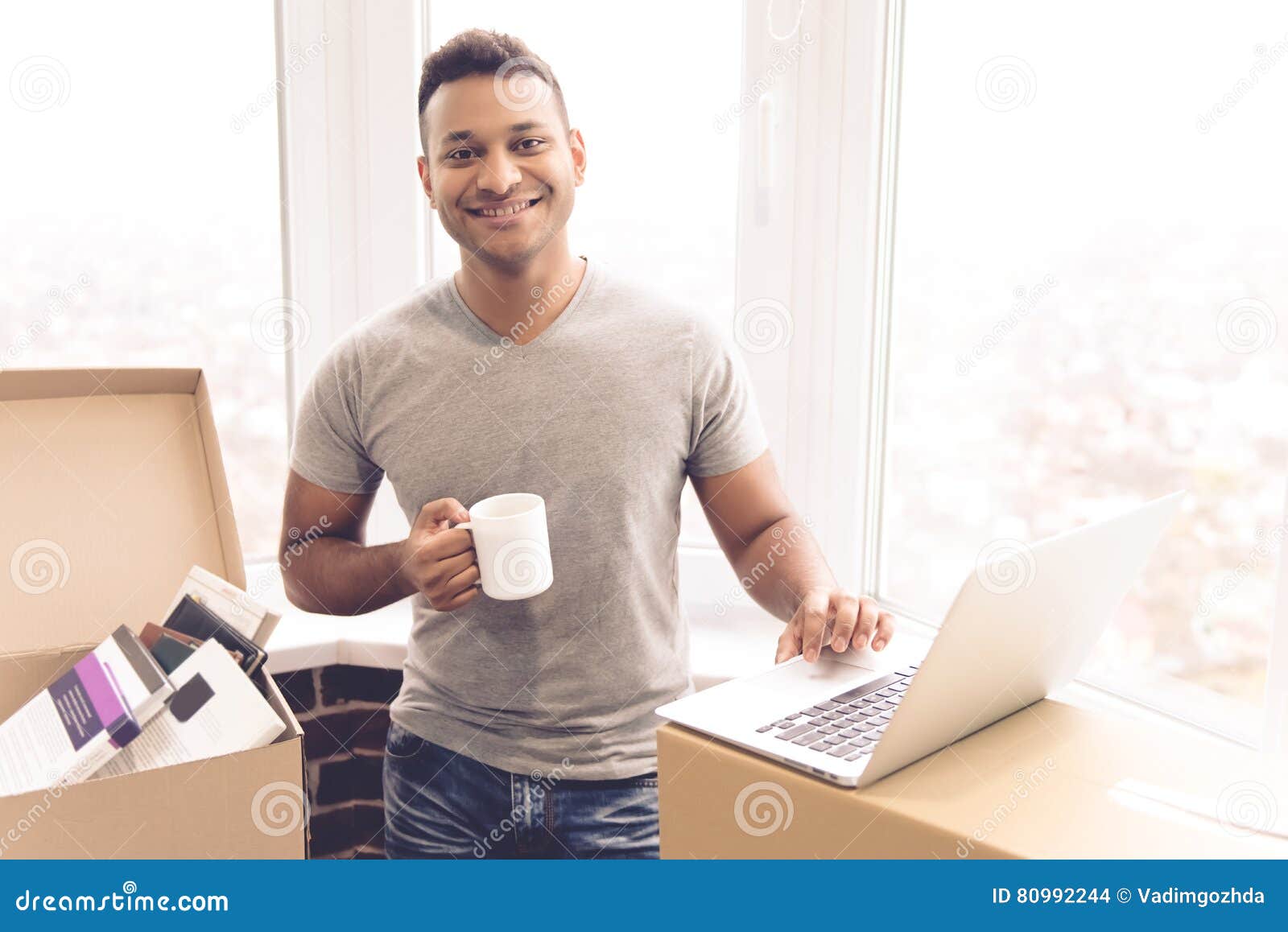 Handsome man moving stock photo. Image of american, property - 80992244