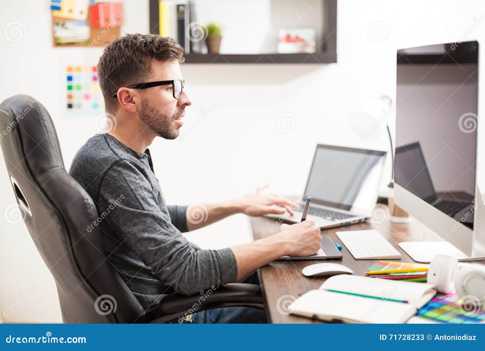 Handsome Man Multitasking at the Office Stock Image - Image of laptop ...
