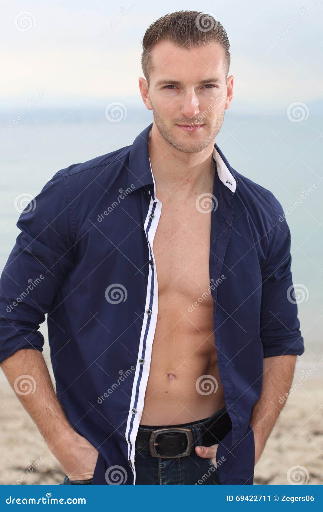 Handsome man near the sea stock image. Image of male - 69422711