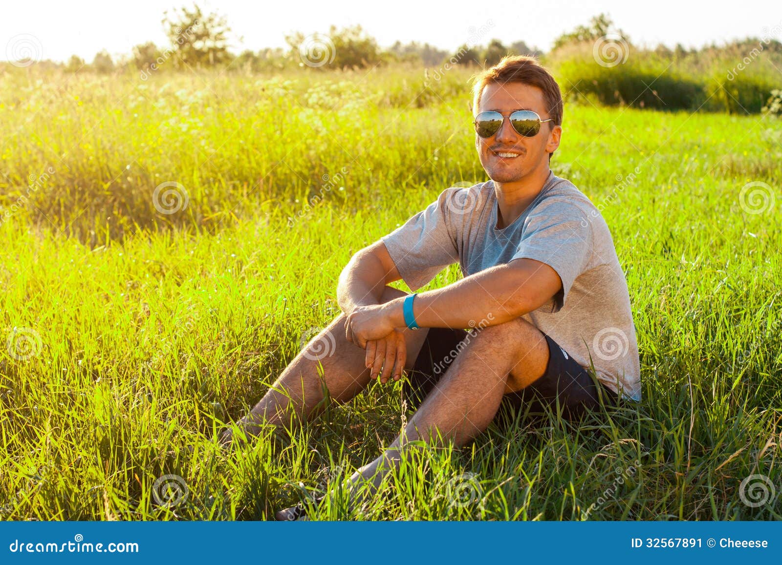 Handsome man in the park stock image. Image of leisure - 32567891
