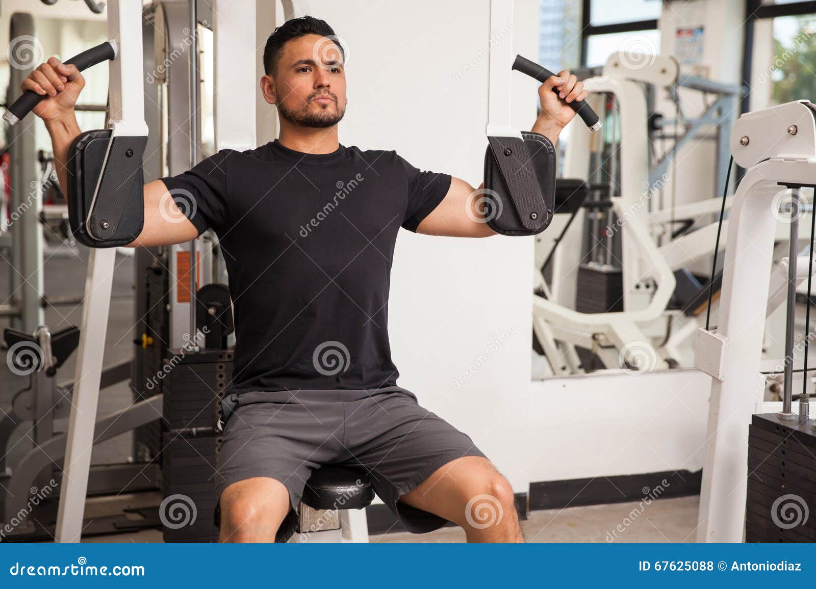 Handsome Man on a Pec Deck Machine Stock Photo - Image of training ...