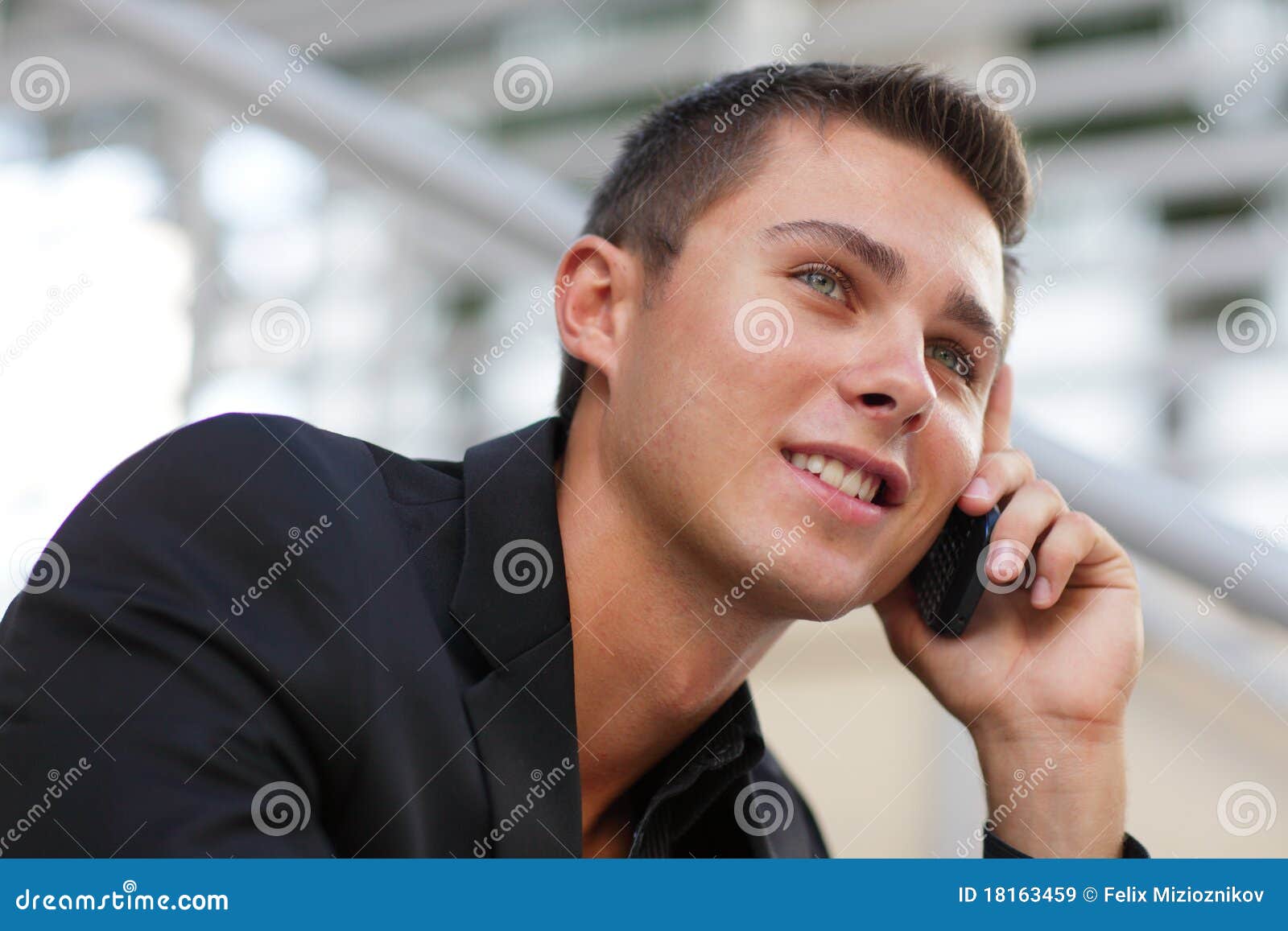 Handsome man on the phone stock image. Image of expression - 18163459