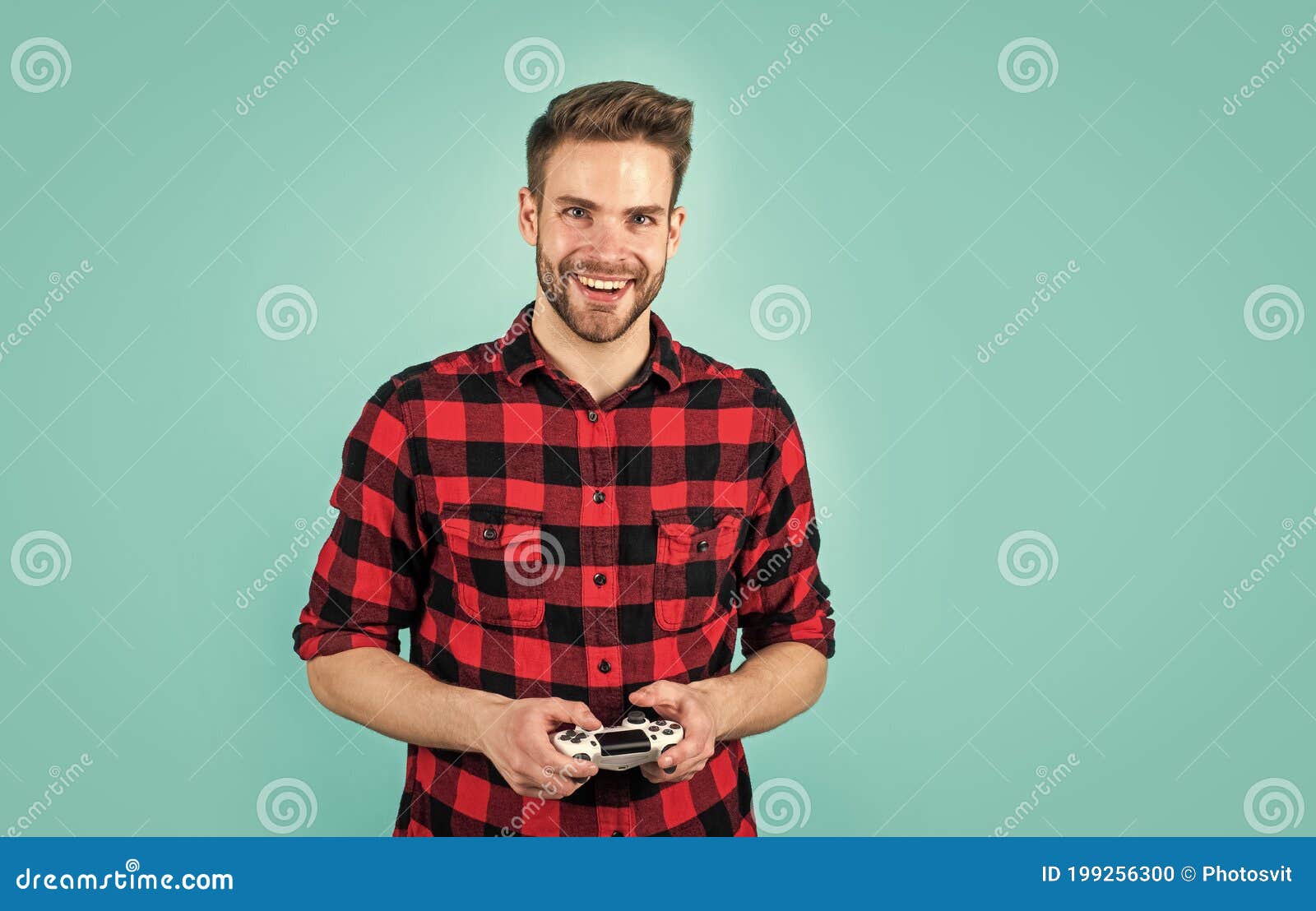 Handsome Man Play with Game Console. Modern Technology and Engineering ...
