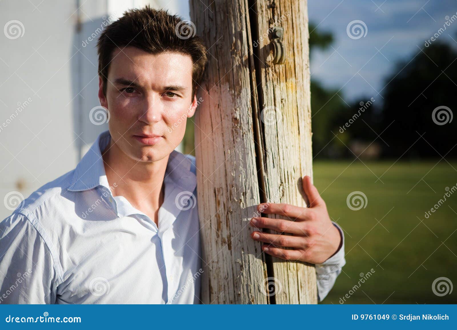Handsome man by the pole stock image. Image of relaxed - 9761049