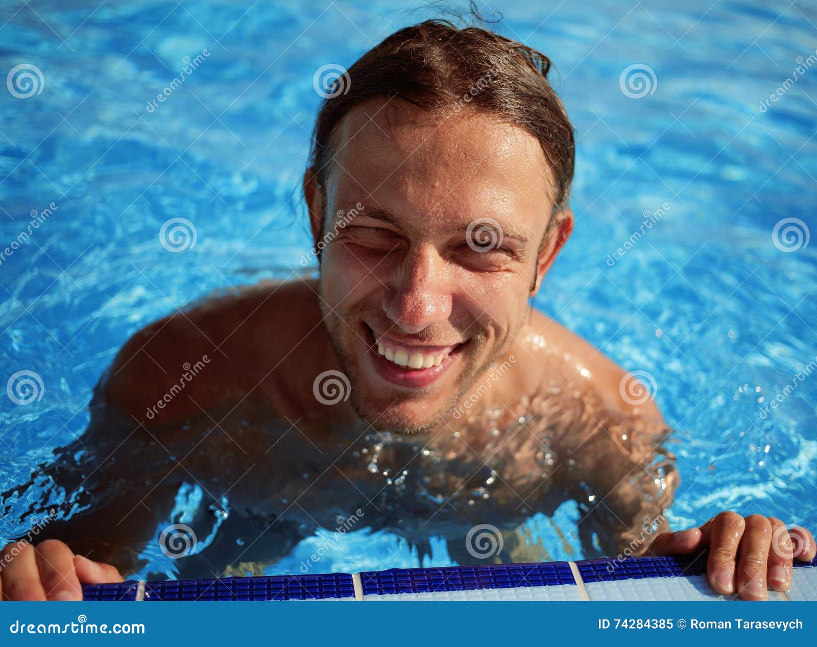 Handsome man in the pool stock image. Image of vacation - 74284385