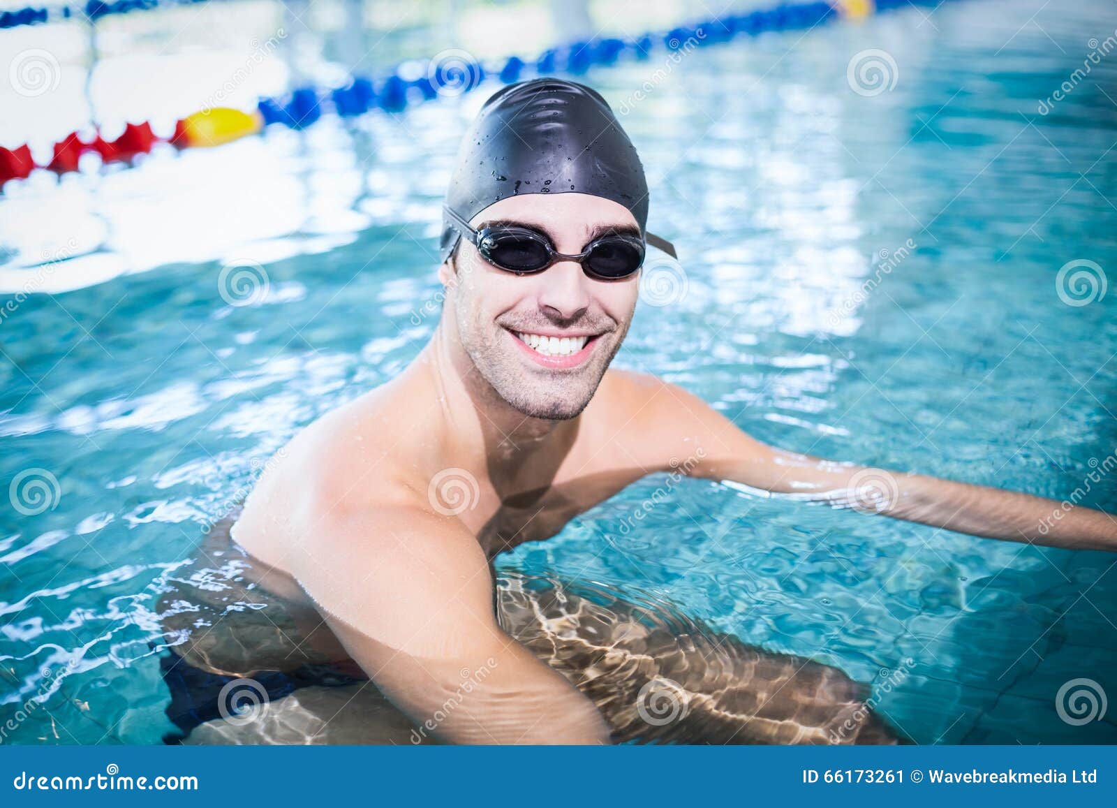 Handsome man in the pool stock image. Image of center - 66173261