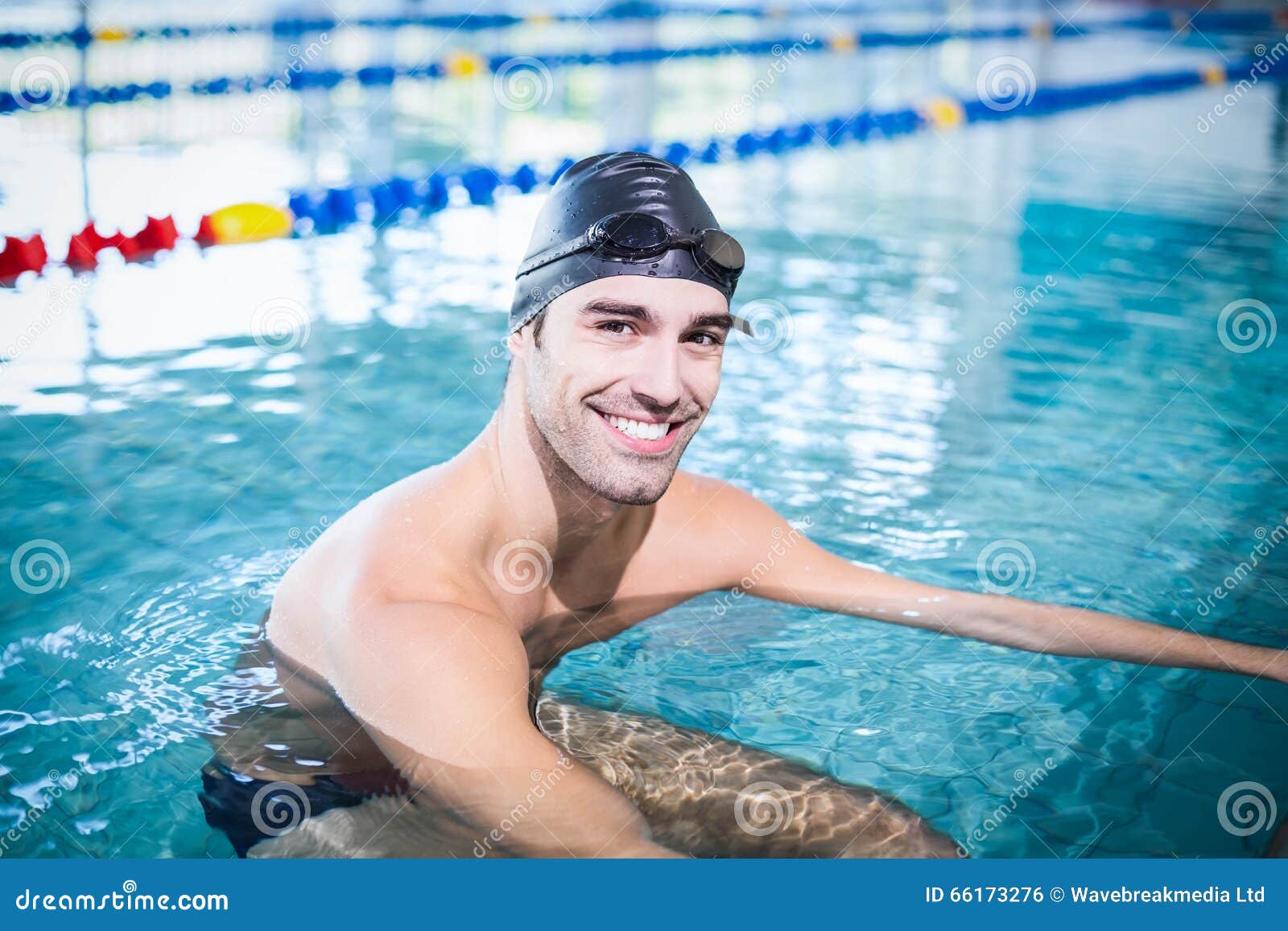 Handsome man in the pool stock photo. Image of smiling - 66173276