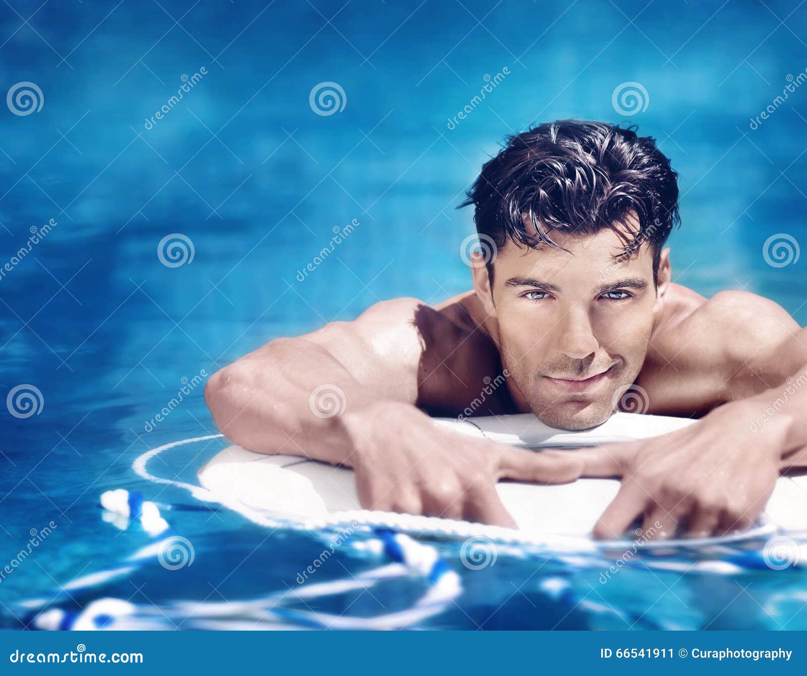 Handsome man in pool stock image. Image of pool, blue - 66541911