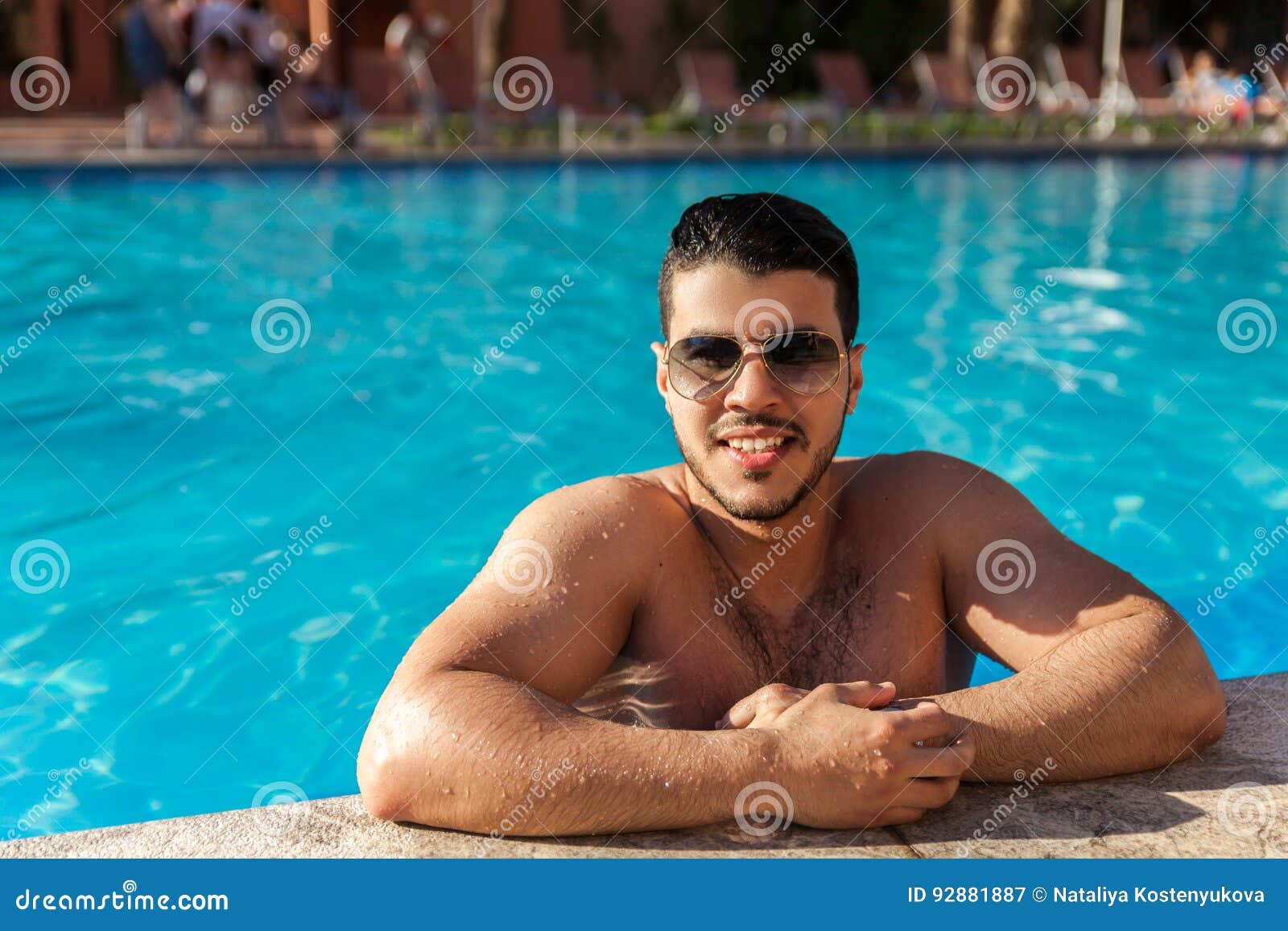 Handsome man in pool stock image. Image of luxury, blue - 92881887