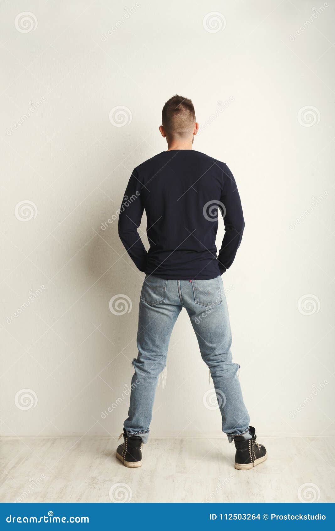 Handsome Man Posing in Studio, Back View Stock Photo - Image of ...