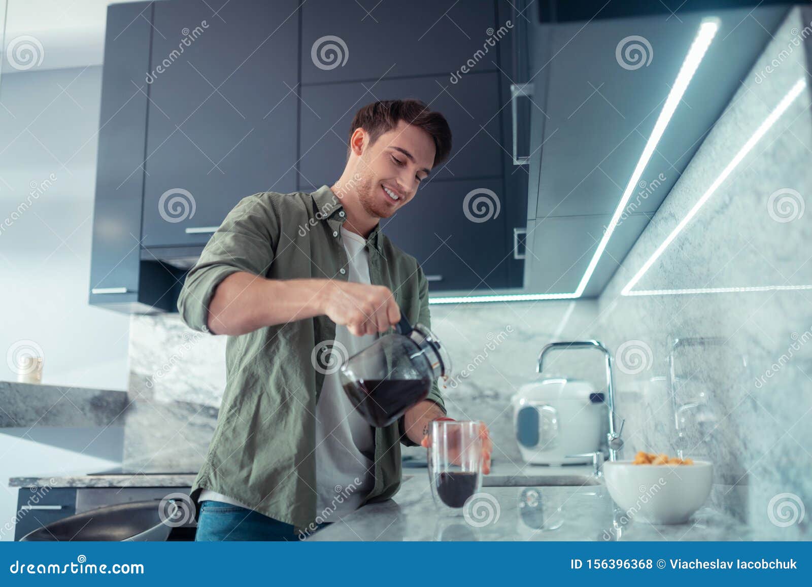 Handsome Man Pouring Coffee into Cup in the Morning Stock Photo - Image ...