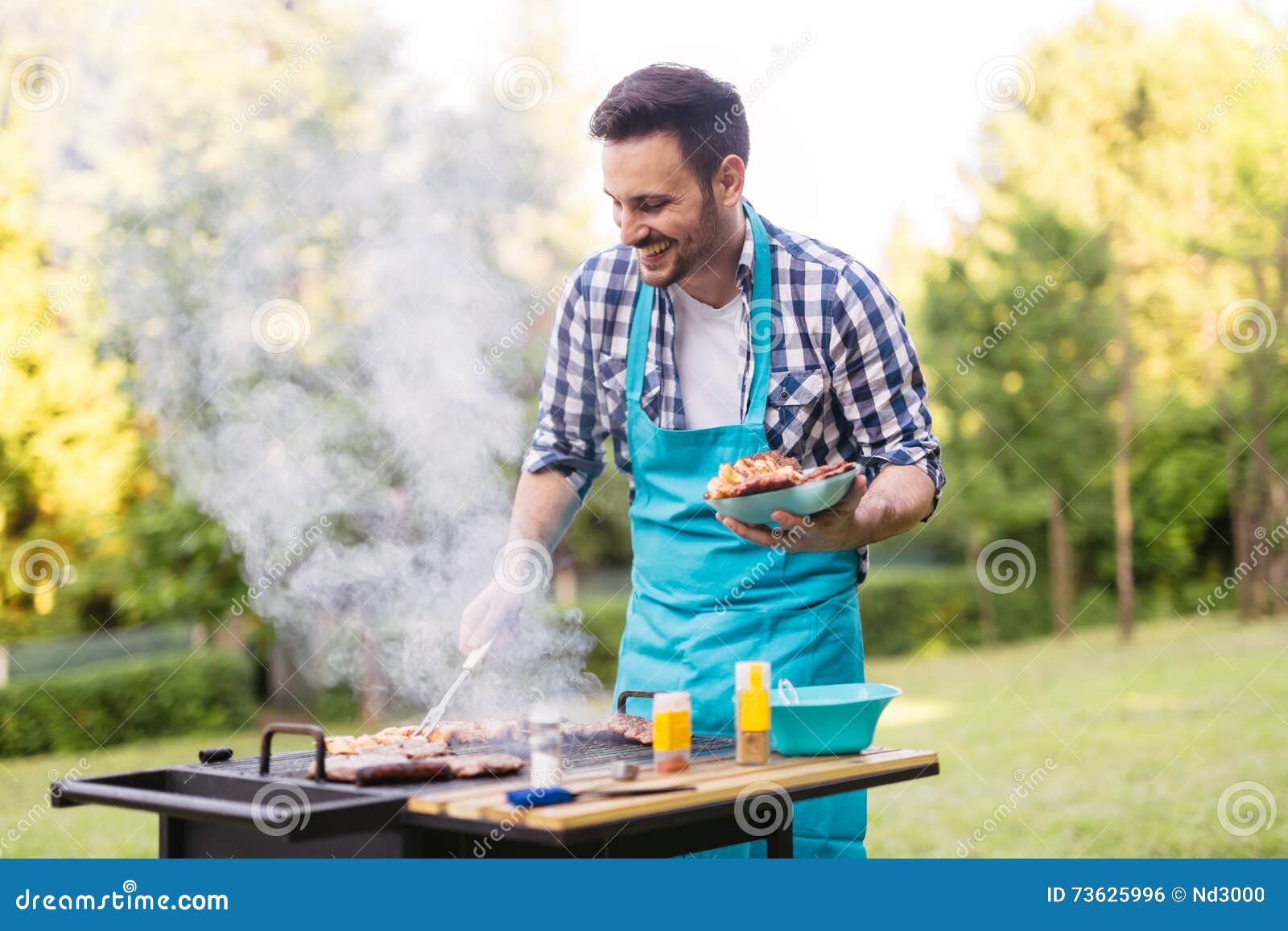 Handsome Man Preparing Barbecue Stock Photo - Image of barbecue, people ...