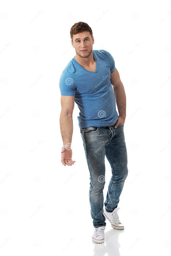 Handsome Man Reaching for Something on the Floor. Stock Photo - Image ...